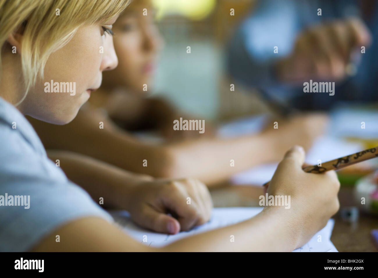 Student writing classwork assignment Stock Photo - Alamy