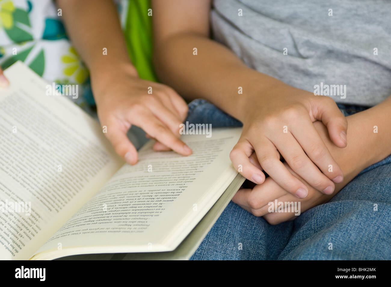 Children reading together Stock Photo - Alamy