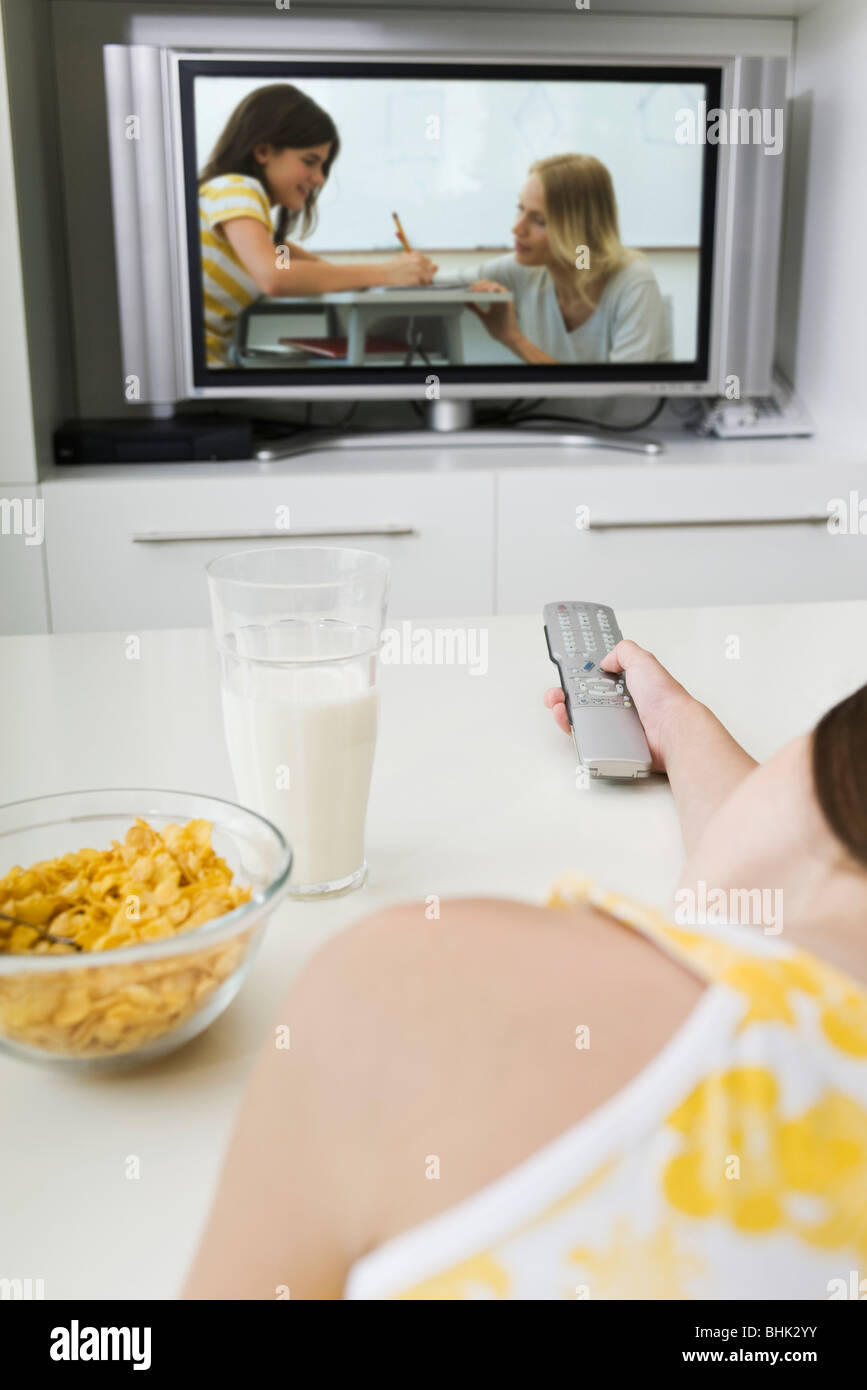 Watching television while having breakfast Stock Photo - Alamy