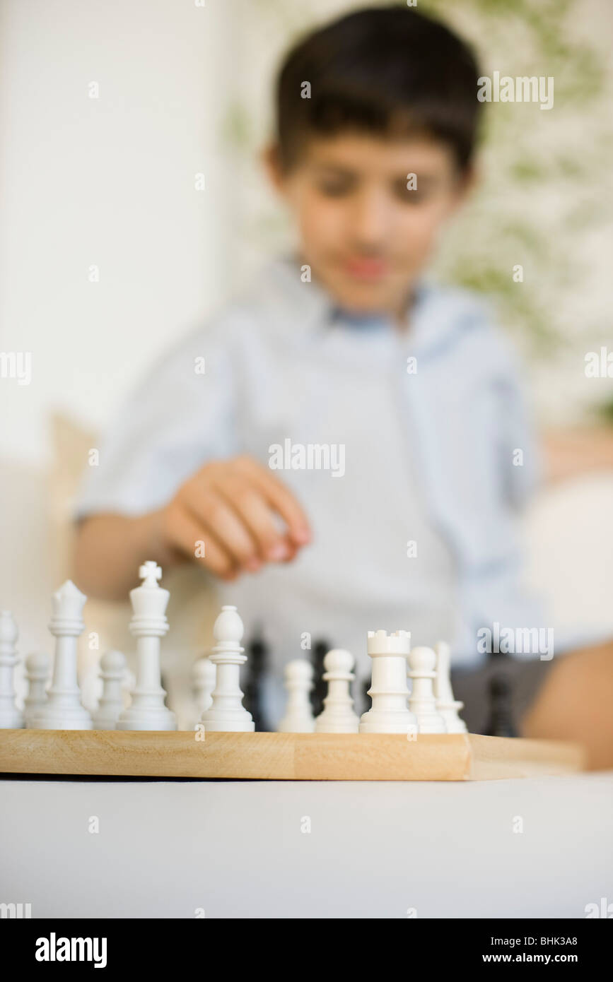 Boy playing chess Stock Photo - Alamy