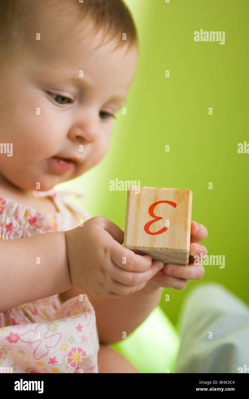 Girl holding number blocks hi-res stock photography and images - Alamy