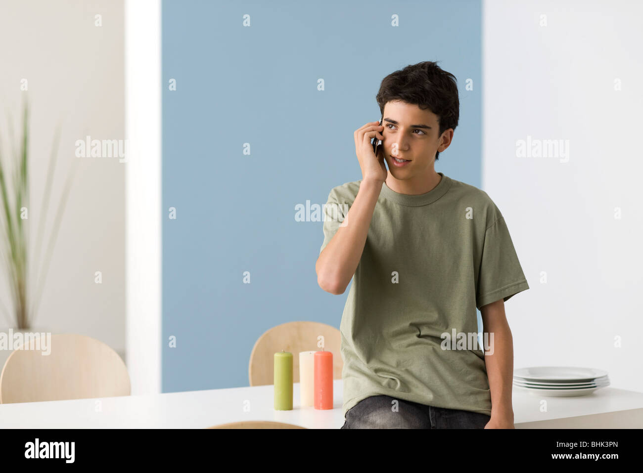 Teenage boy using cell phone Stock Photo - Alamy