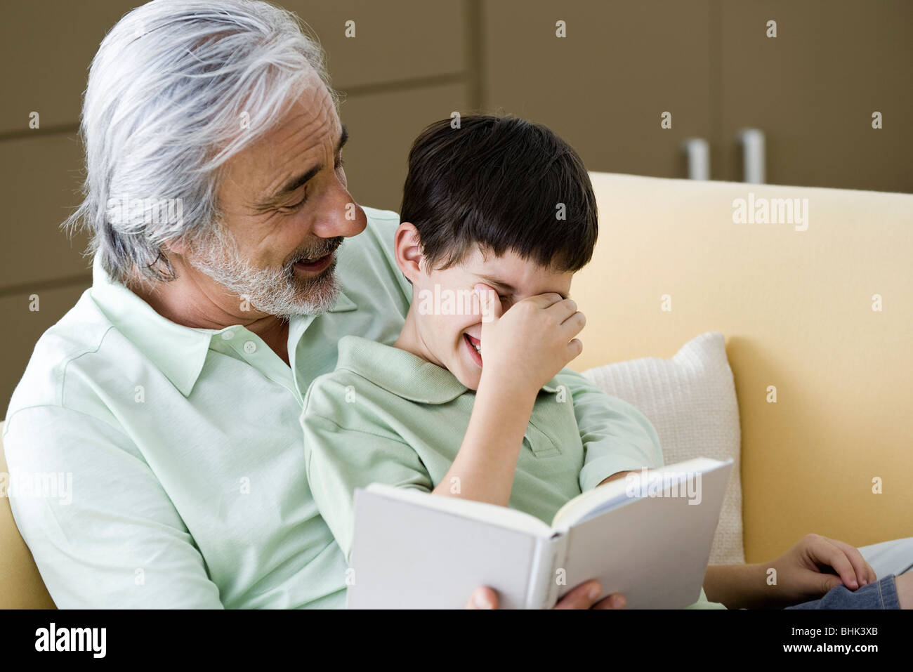 Grandfather reading story grandson hi-res stock photography and images ...