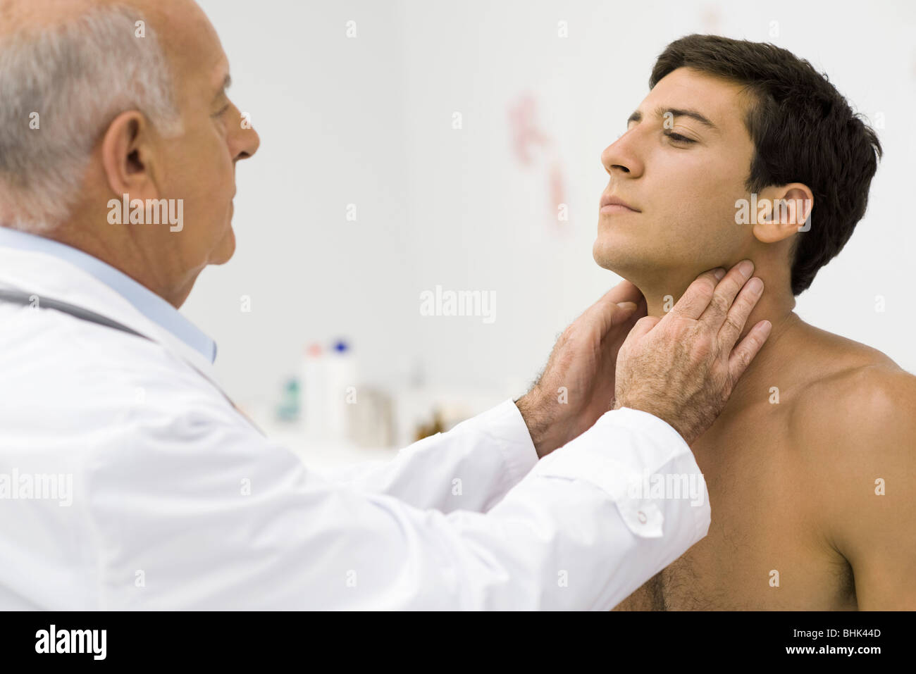 Doctor checking patient's lymph nodes Stock Photo - Alamy