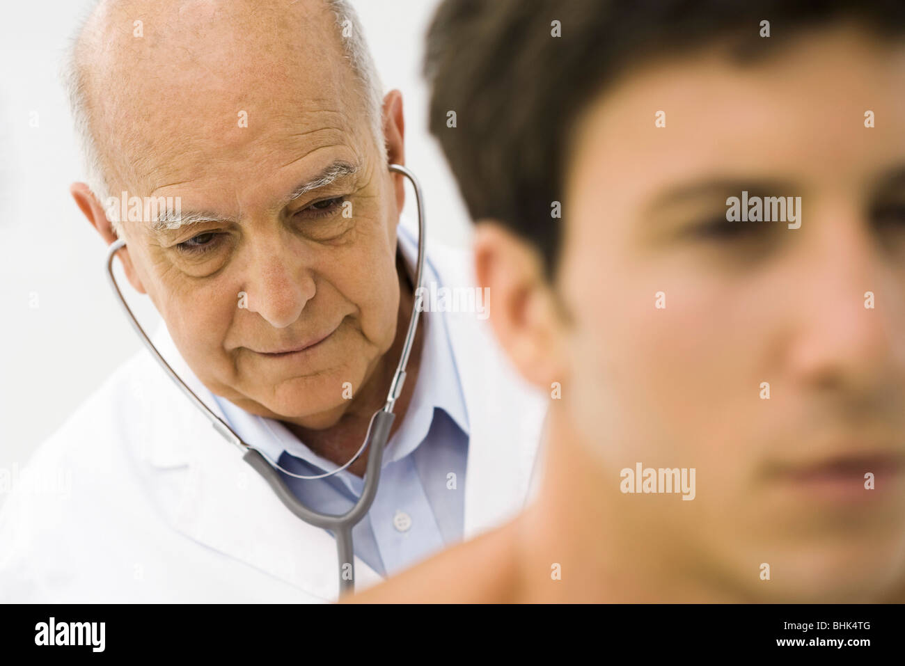 Doctor conducting medical exam Stock Photo - Alamy