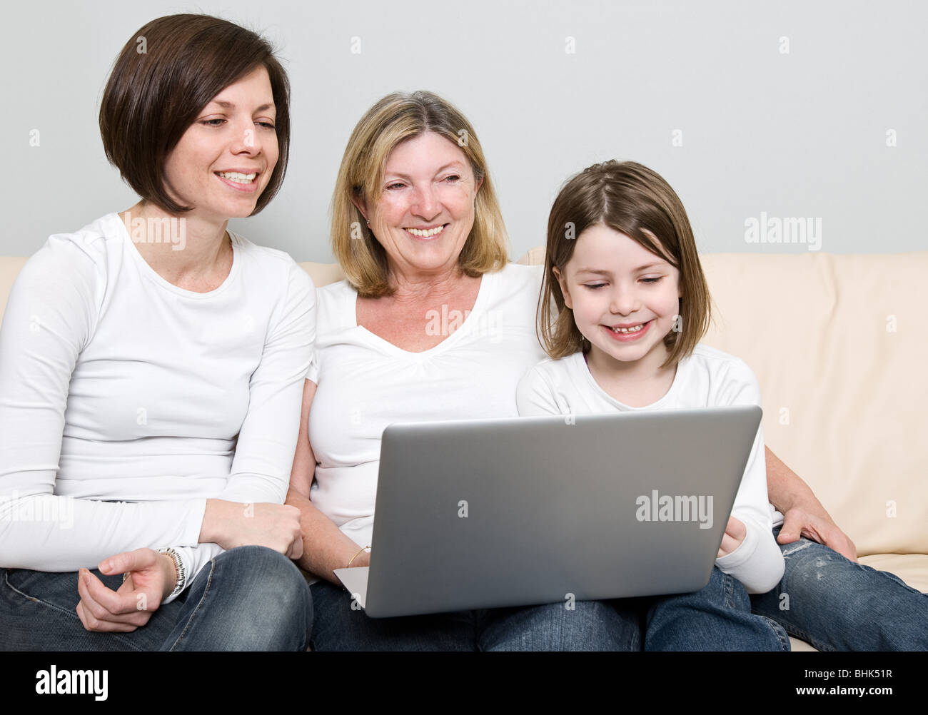 Family generations using laptop computer hi-res stock photography and ...