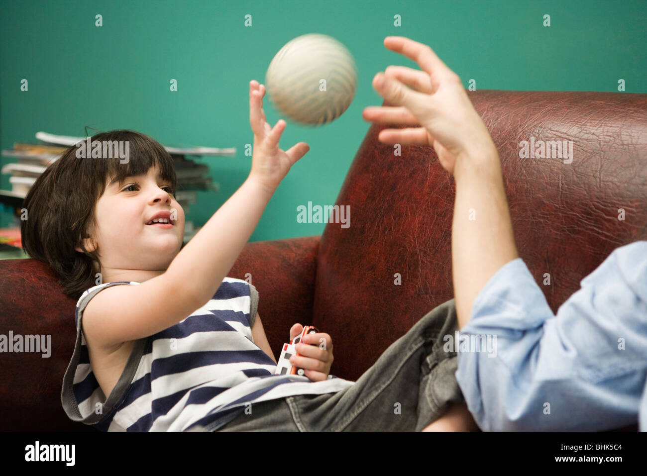 Hand children catching ball on hi-res stock photography and images - Alamy