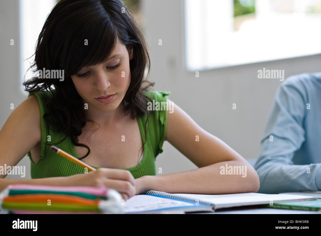 Student doing classwork hi-res stock photography and images - Alamy