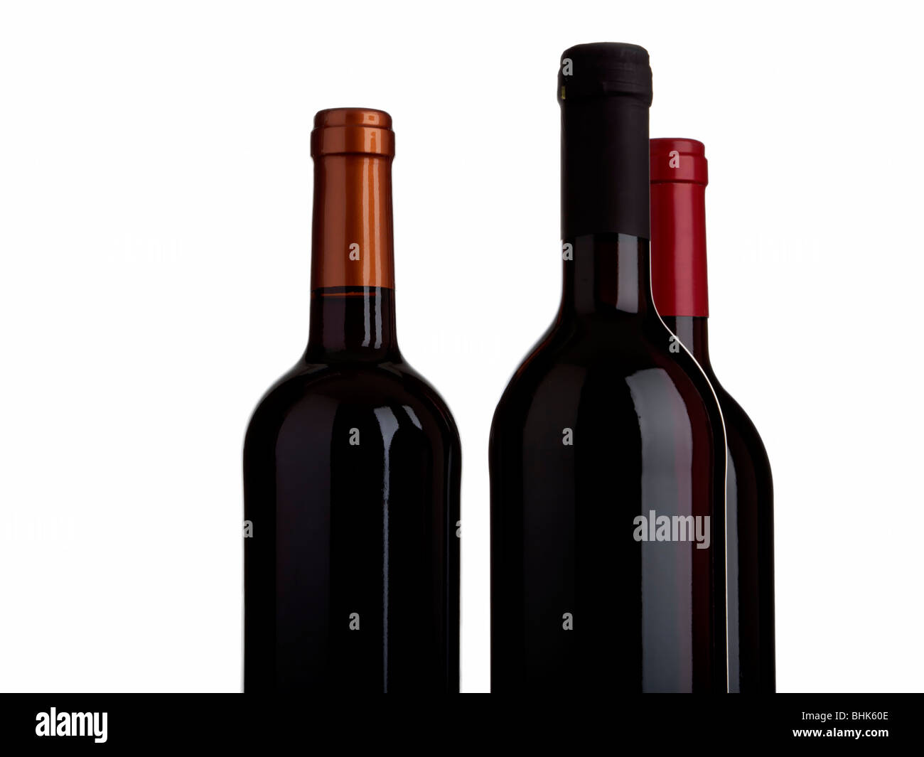 three red wine bottles, no labels, upper halves, isolated on white ...