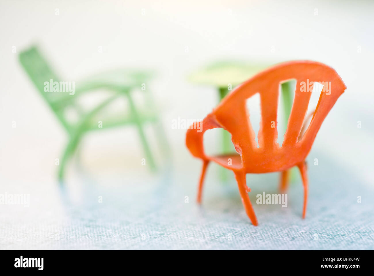 Miniature plastic chairs Stock Photo - Alamy
