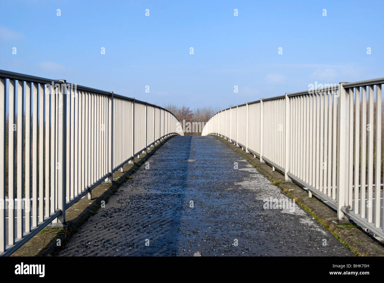 empty footbridge with railings over the M3 motorway in shepperton ...
