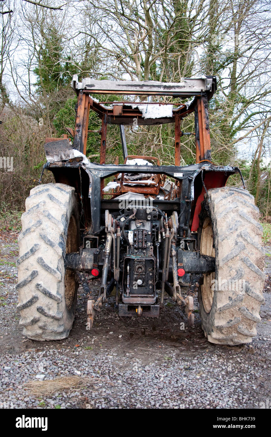 Burnt out stolen tractor in a countryside lane Stock Photo - Alamy