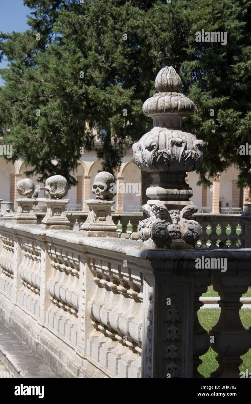 Stone carved balustrade with skulls around a monastery cemetery, Italy ...