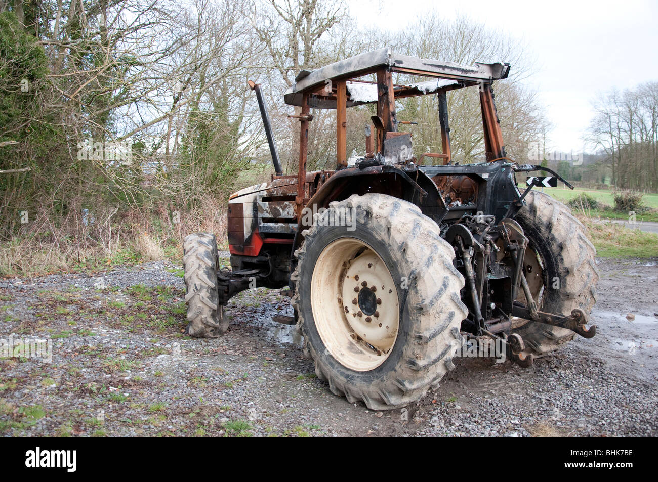 Burnt out stolen tractor in a countryside lane Stock Photo - Alamy