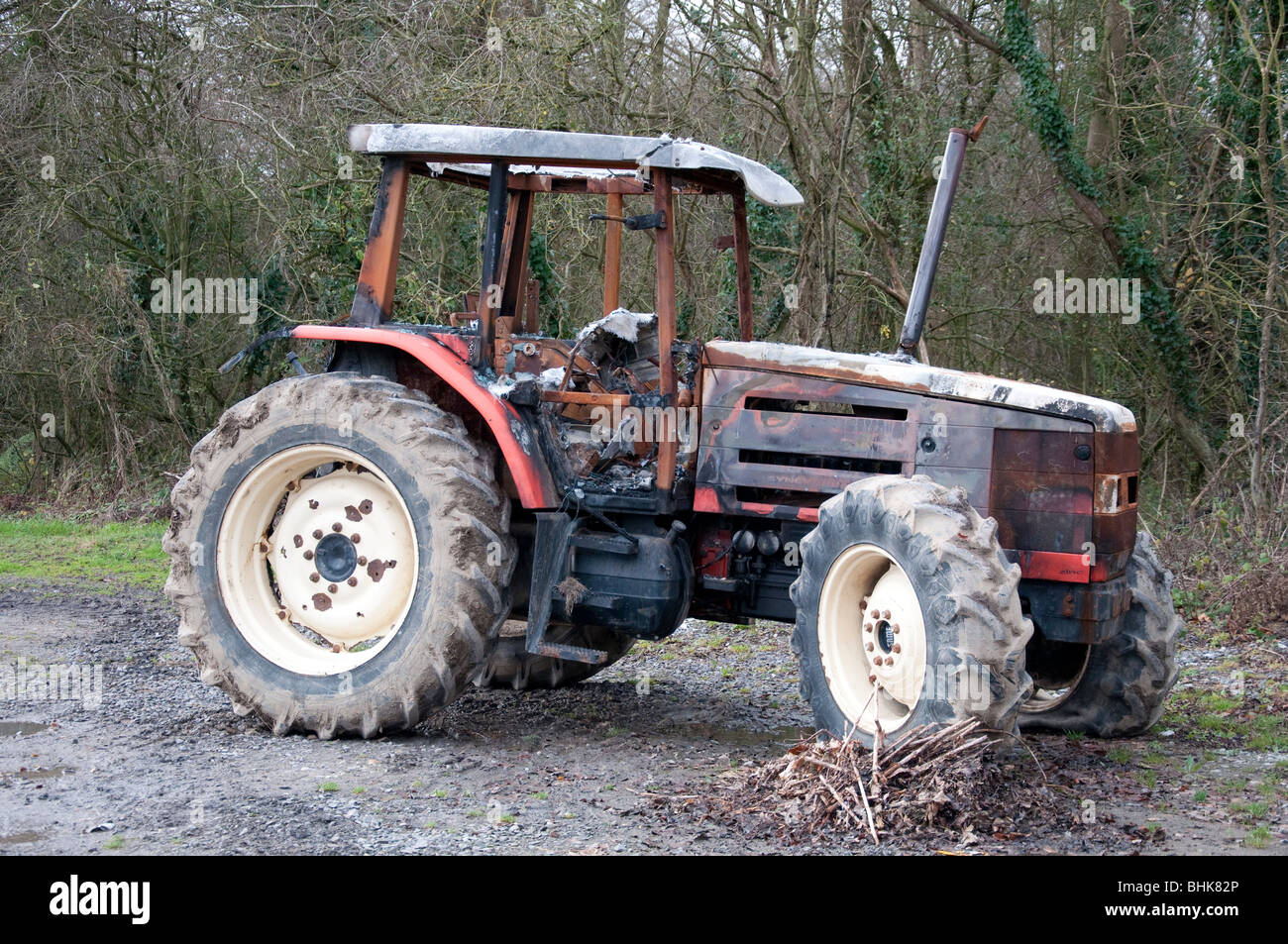 Burnt out stolen tractor in a countryside lane Stock Photo - Alamy