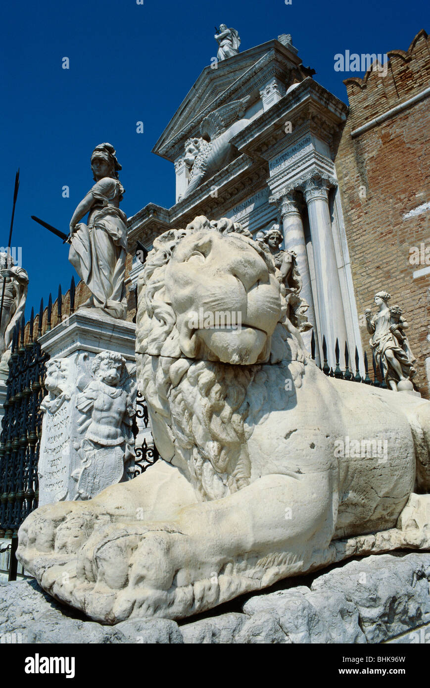 Venice. Italy. Lion statue stands on guard outside the gate of the ...