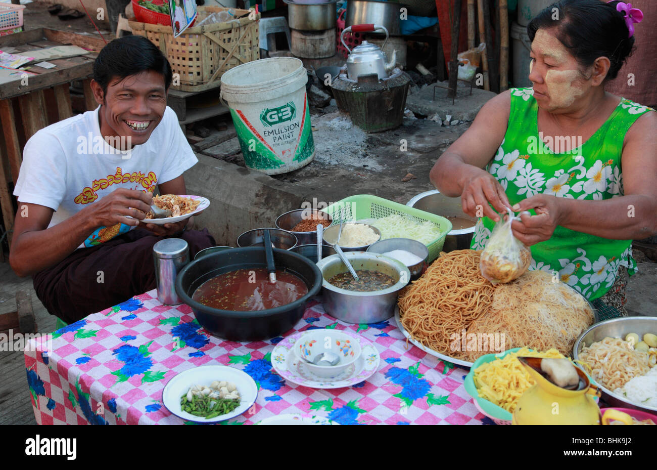 Myanmar, Burma, Yangon, Rangoon, street food stall, people eating Stock ...