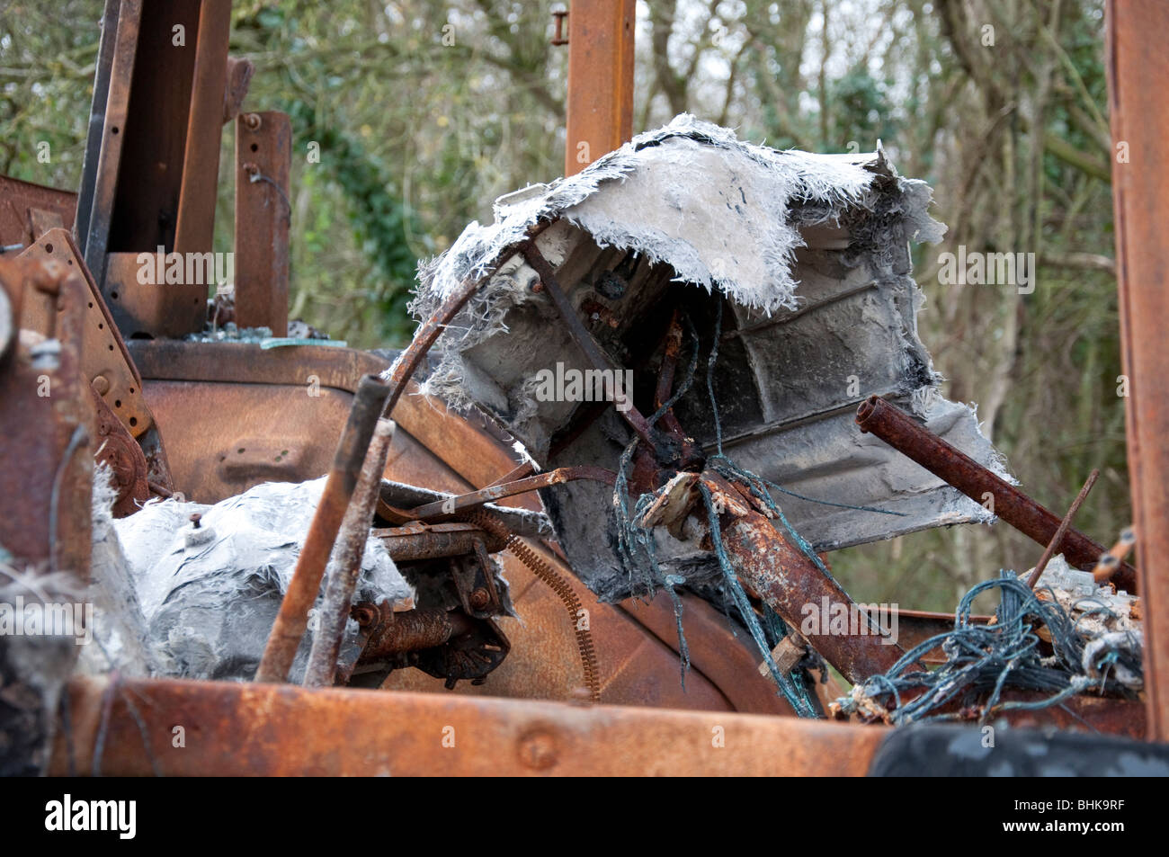 Burnt out stolen tractor in a countryside lane Stock Photo - Alamy