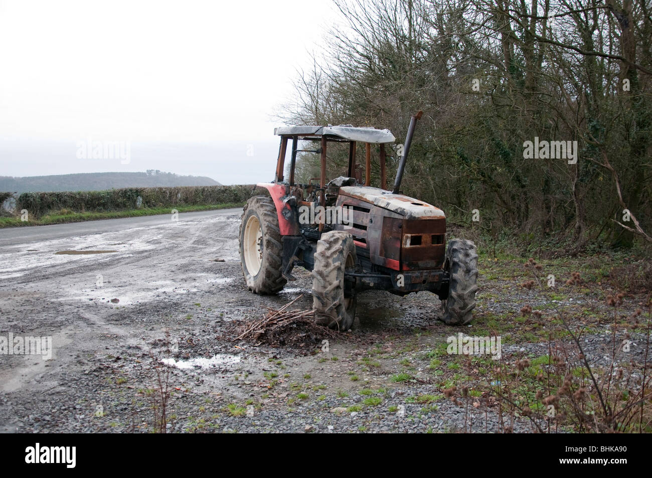 Burnt out stolen tractor in a countryside lane Stock Photo - Alamy