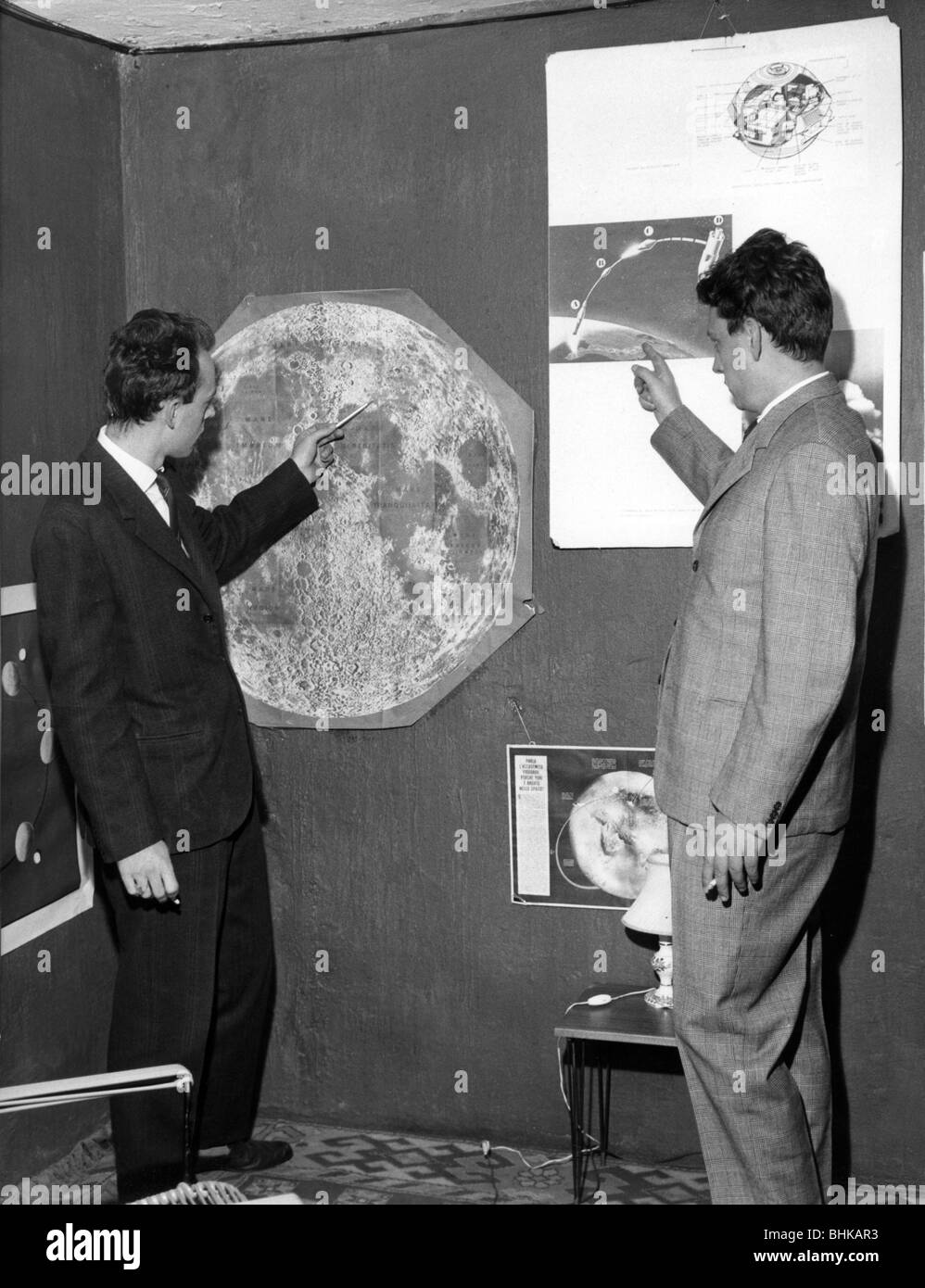 astronomy, moon, scientists in front of an image of the moon, circa ...