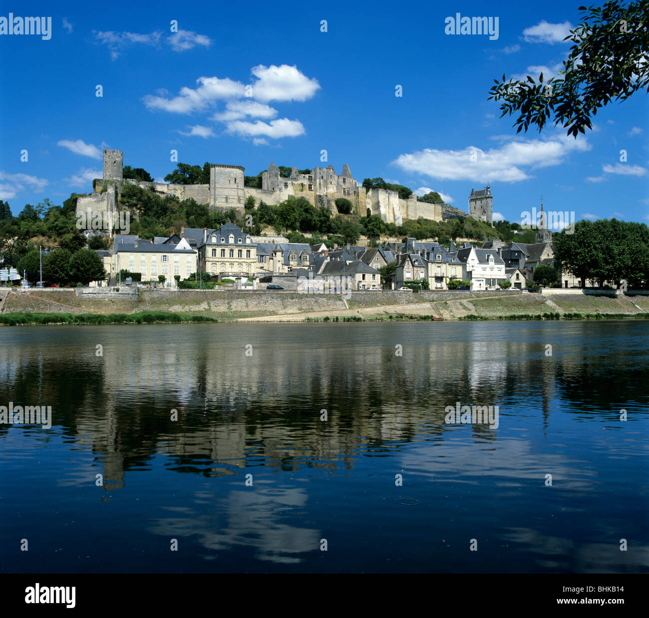 Town and ruined chateau reflected in La Vienne river Stock Photo - Alamy