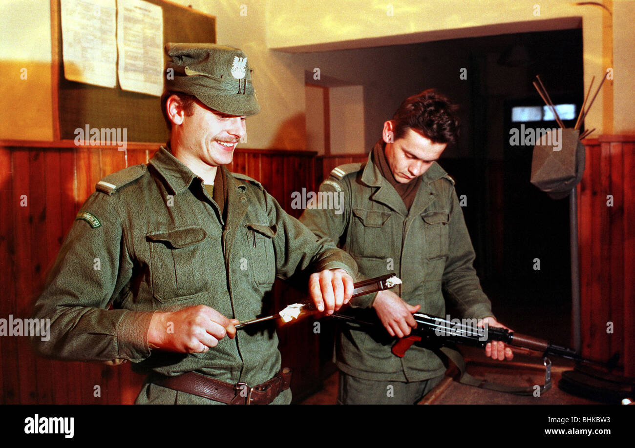 Polish customs officers cleaning their Kalashnikovs, Poland Stock Photo ...