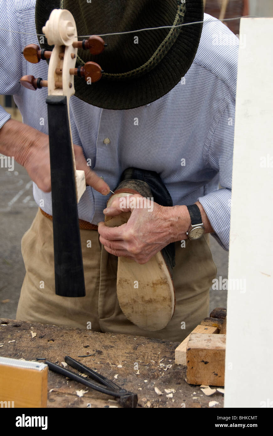 Cobbler mending hobnail wooden sole boots at Traditional crafts at a ...