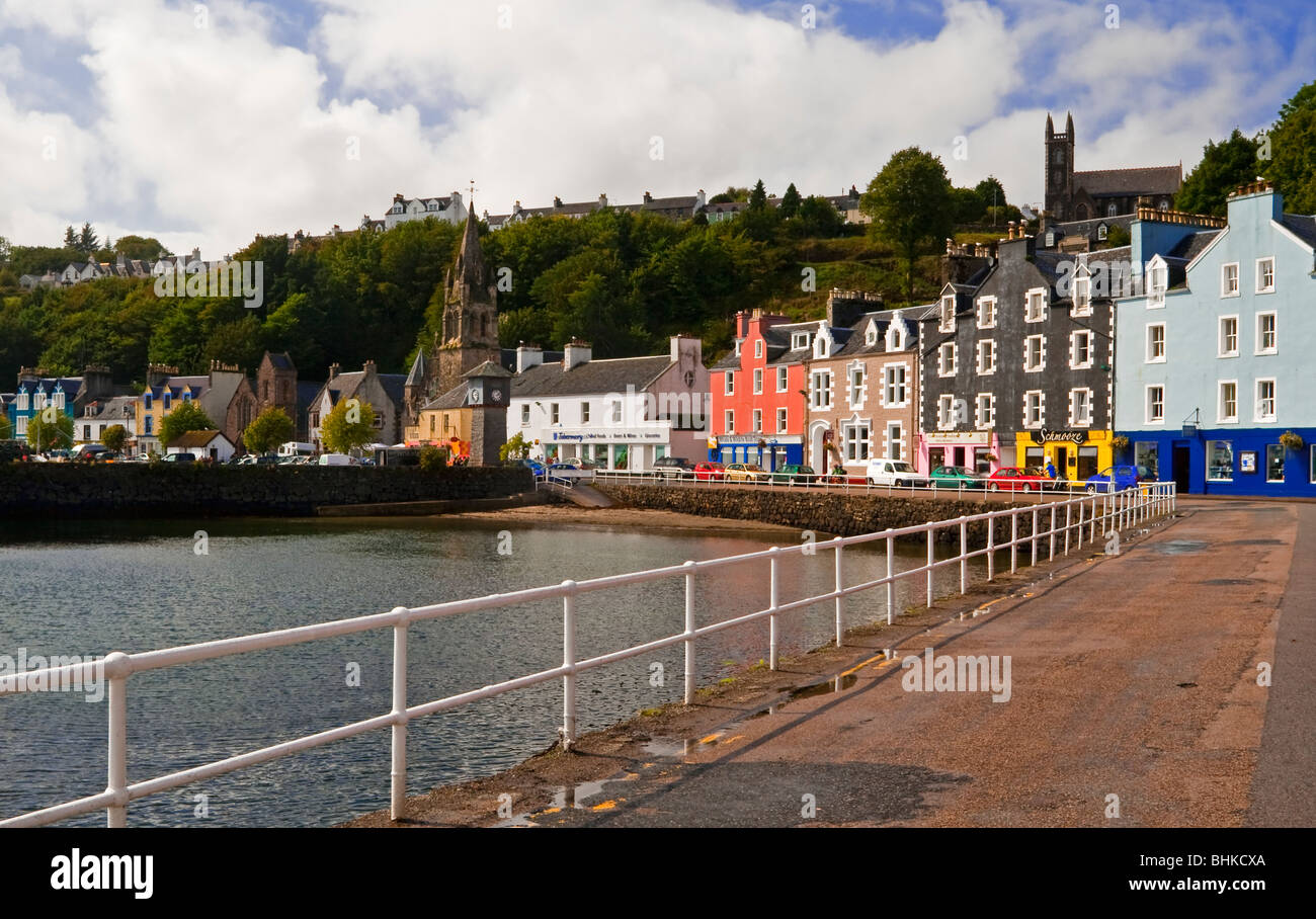View of the brightly coloured shops and houses on the harbour front at ...