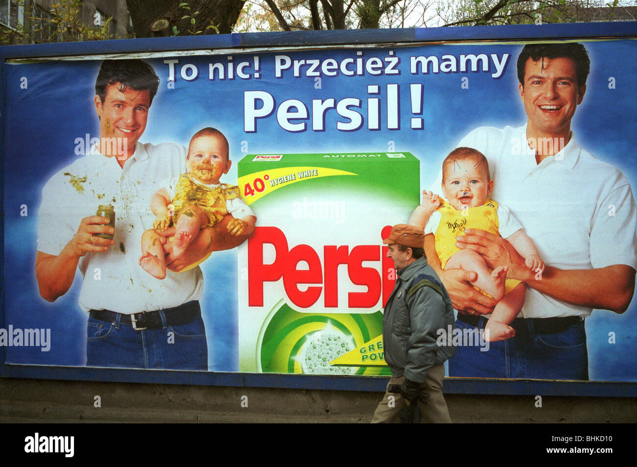Man passing by an advertising board, Wroclaw, Poland Stock Photo - Alamy