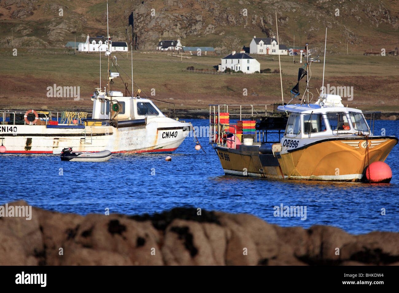 Fishing boats anchored in the Sound of Iona taken from Fionnphort beach ...