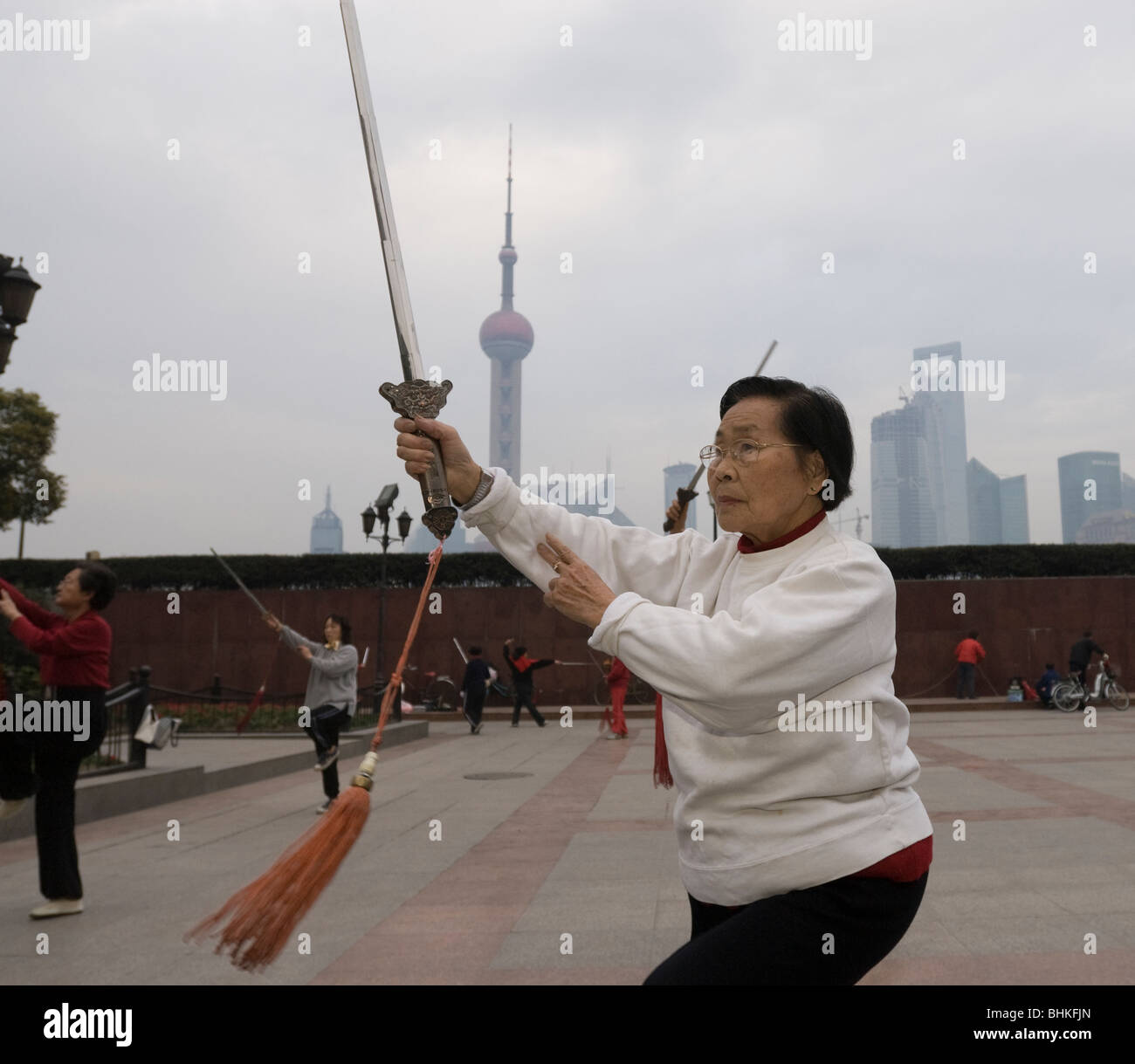 People exercising along the Huang Pu riverfront overlooking the Pudong ...