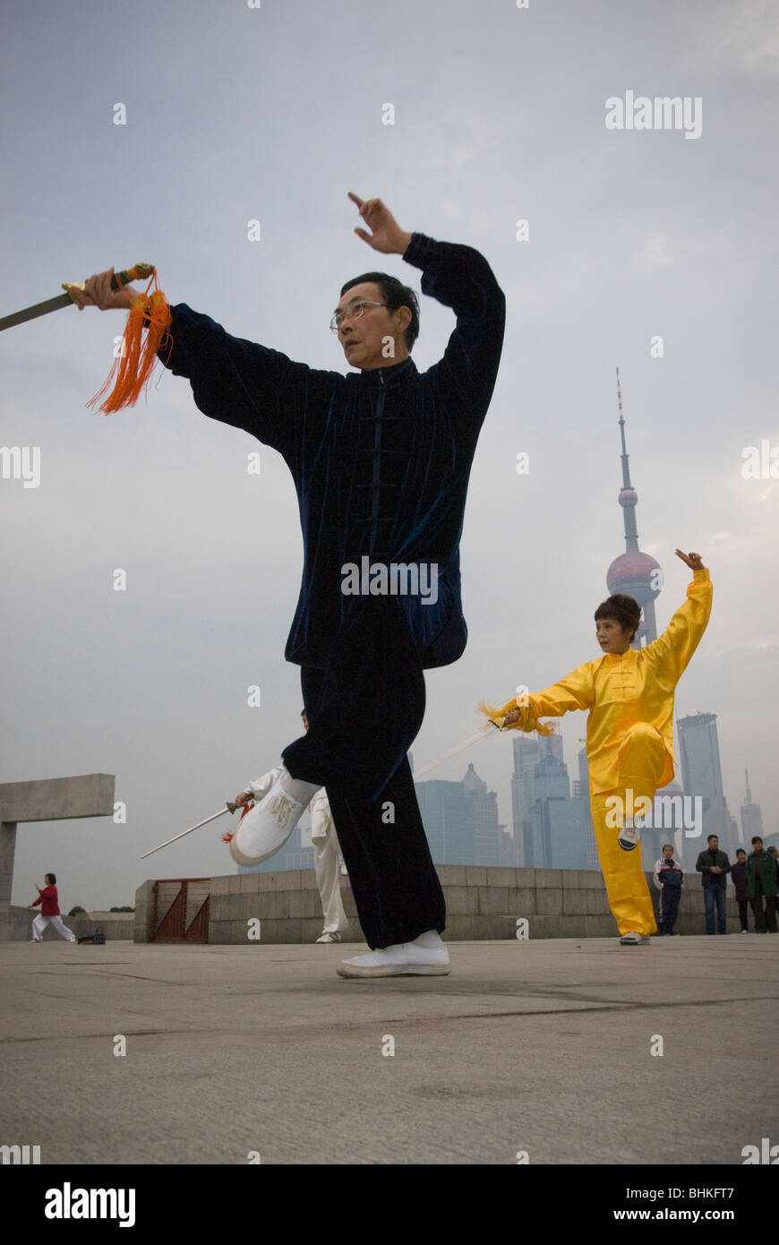 People exercising along the Huang Pu riverfront overlooking the Pudong ...