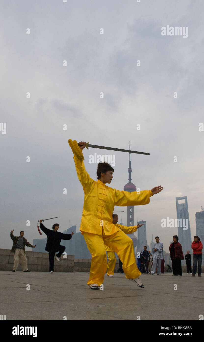 People exercising along the Huang Pu riverfront overlooking the Pudong ...