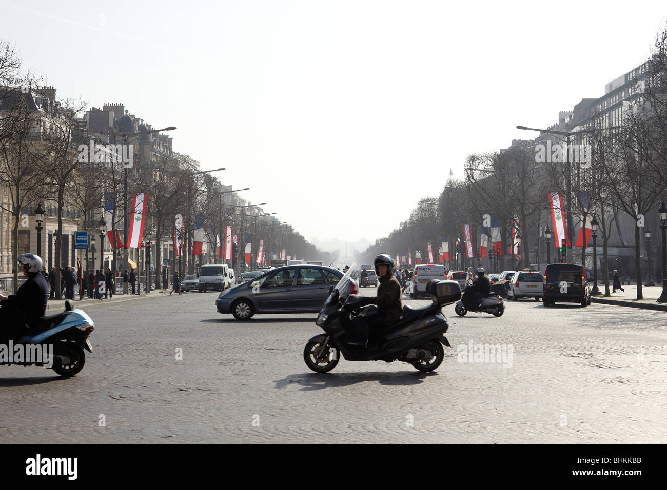 Motorcycle crossing the Champs Elysees, Paris France Stock Photo - Alamy