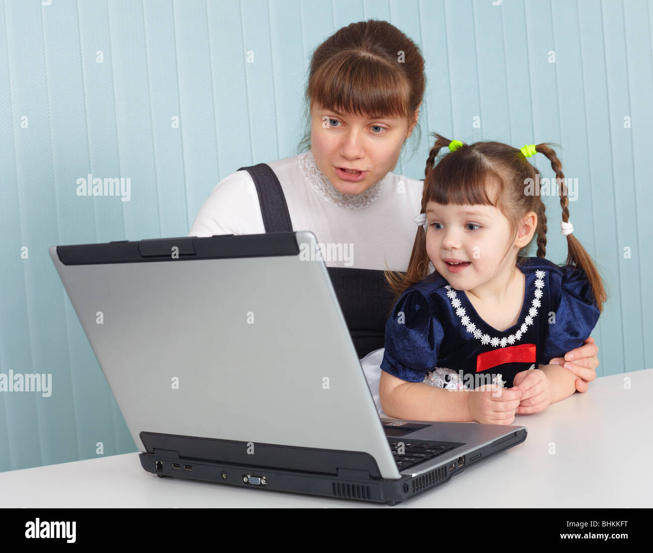 Young mother teaches daughter to use a computer Stock Photo - Alamy