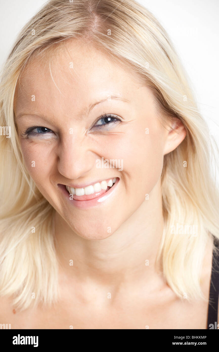 Portrait of a blond girl, smiling Stock Photo - Alamy
