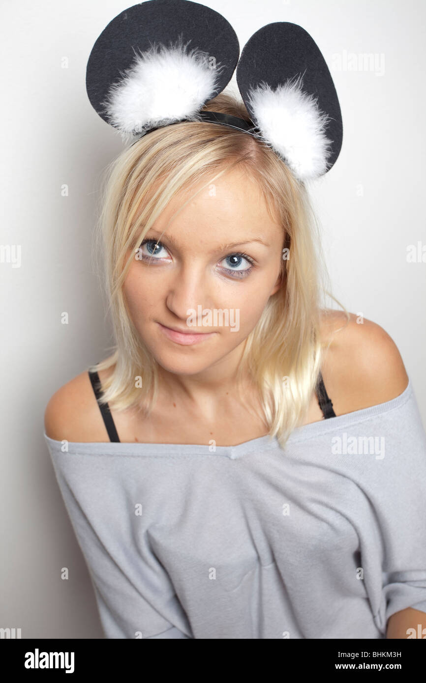 Portrait of a young woman wearing bunny ears Stock Photo - Alamy