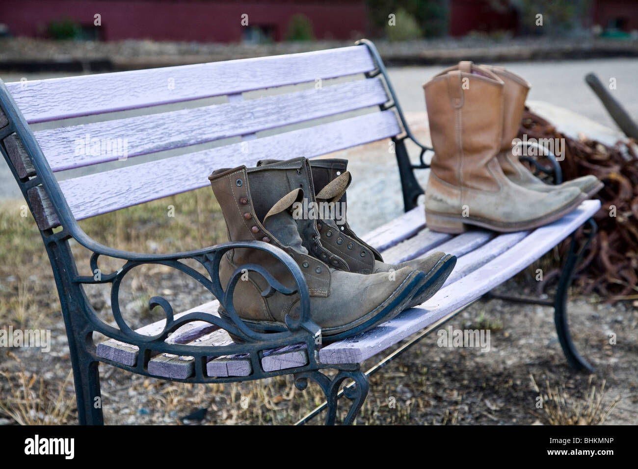 Old work boots sit on a bench in Buena Vista, Colorado Stock Photo - Alamy