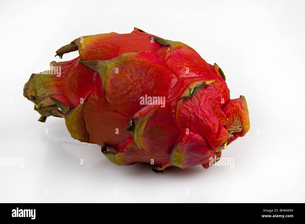 Whole deep red Dragon fruit (pitaya) on white background. horizontal ...