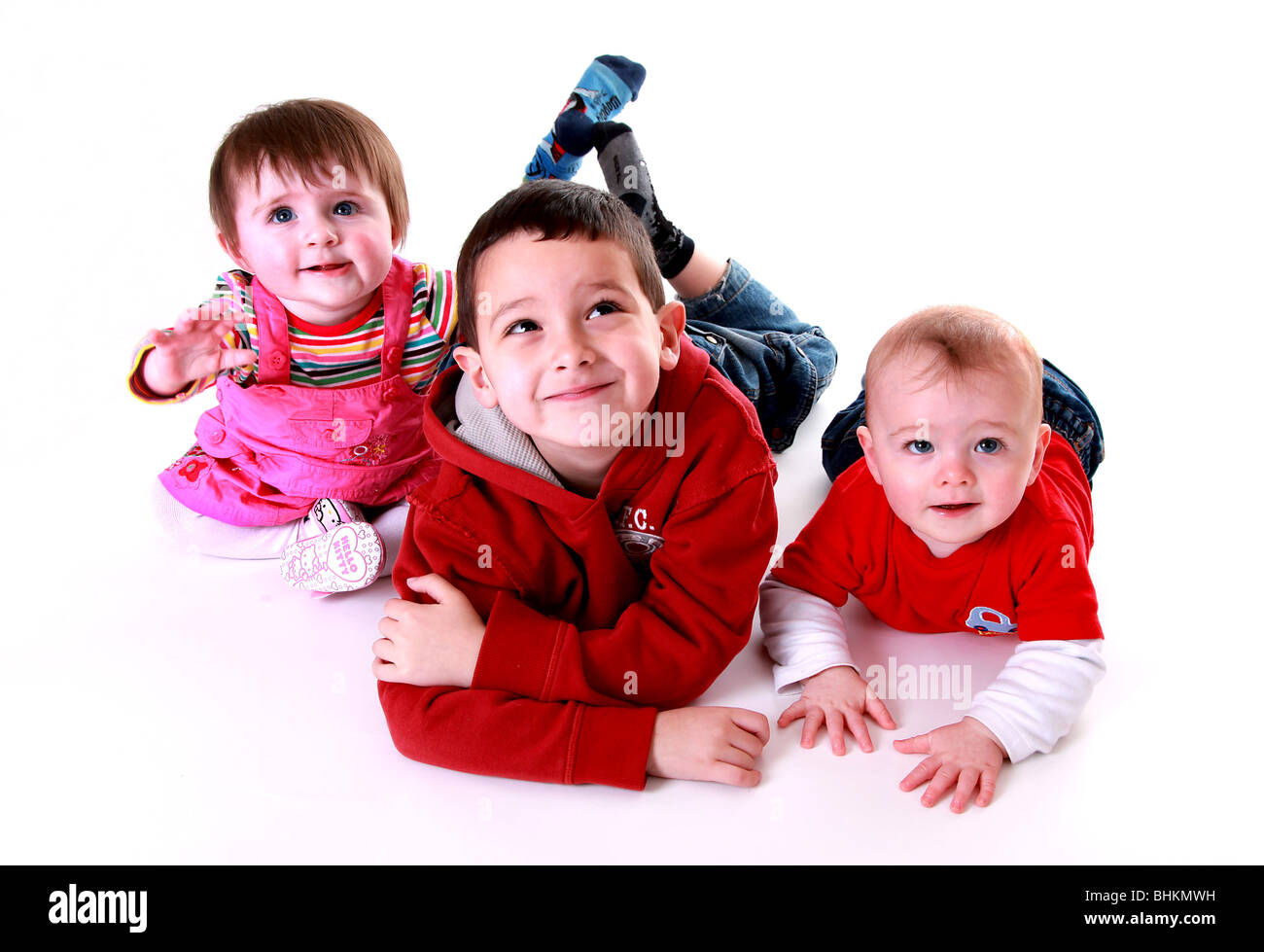 Three children studio portrait Stock Photo - Alamy