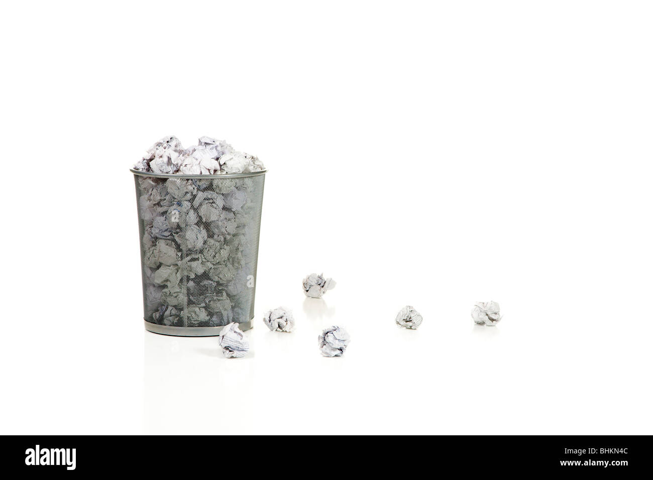 Overflowing office bin Cut Out Stock Images & Pictures - Alamy