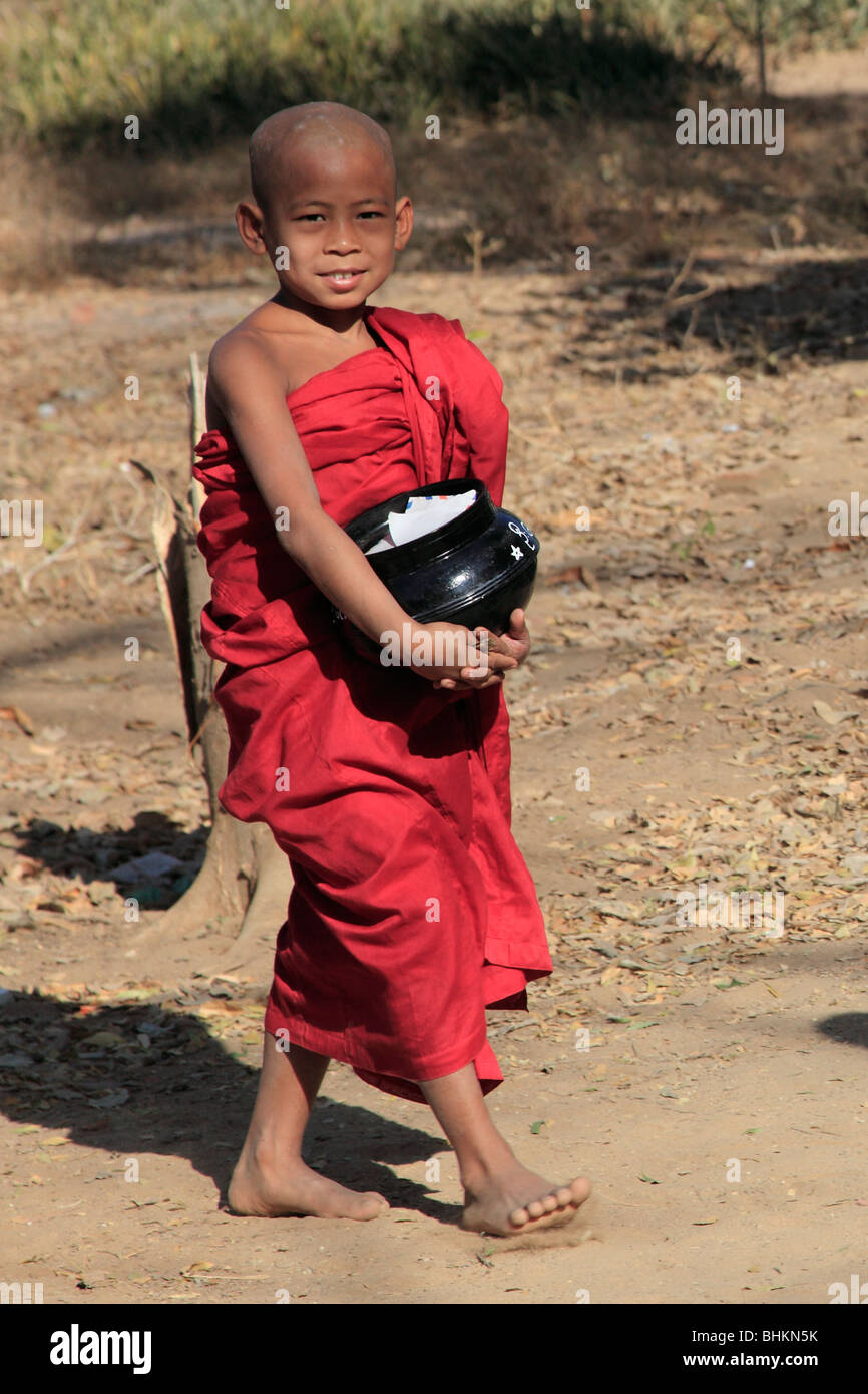 Myanmar, Burma, Bagan, young buddhist monk gathering alms Stock Photo ... Myanmar, Burma, Bagan, young buddhist monk gathering alms Stock Photo ...