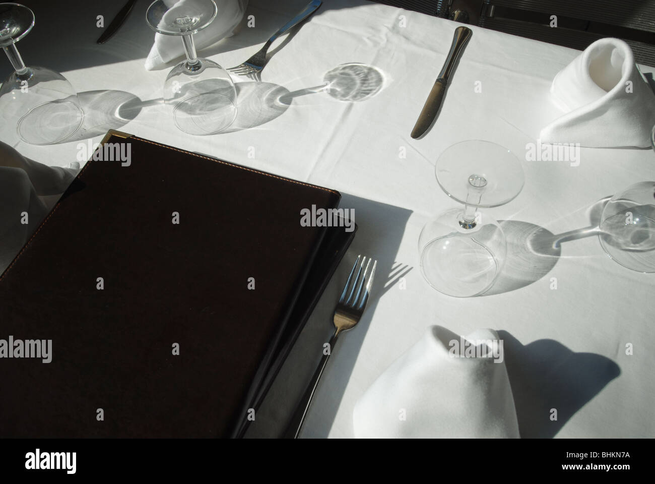 A restaurant table and menu Stock Photo - Alamy