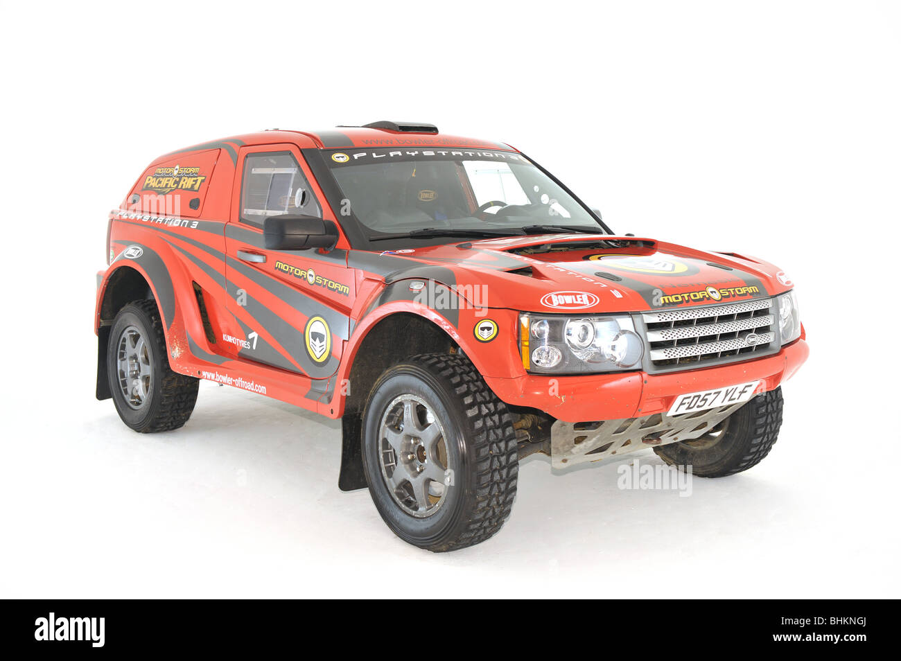 Orange 4 wheel drive race car Stock Photo - Alamy