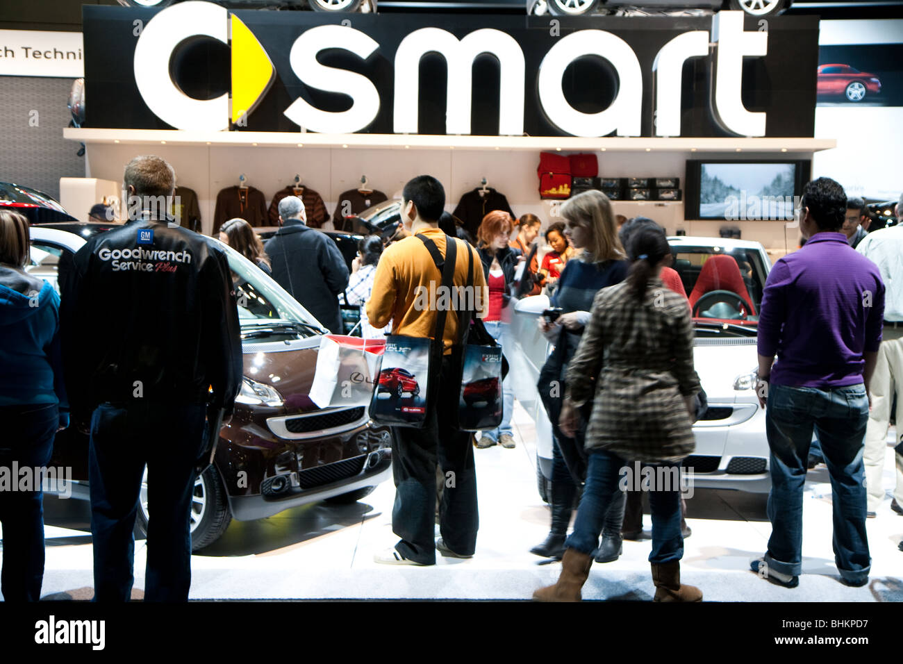 crowd "smart car booth" autoshow Stock Photo - Alamy