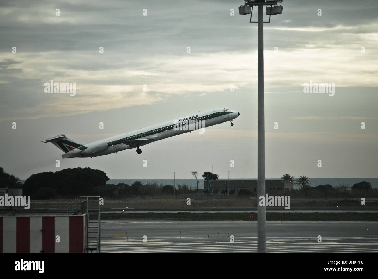 A plane takes off from an airport Stock Photo - Alamy