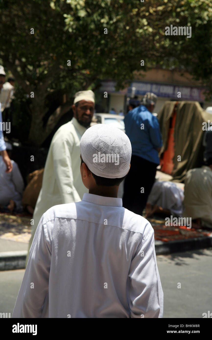 Call for prayer in Dubai. Hundreds of men praying in the streets ...