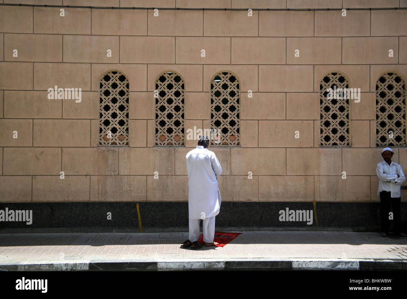 Call for prayer in Dubai. Hundreds of men praying in the streets ...