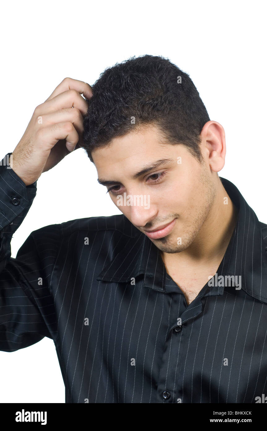 Young man trying to remember while hand scratching his head against a ...