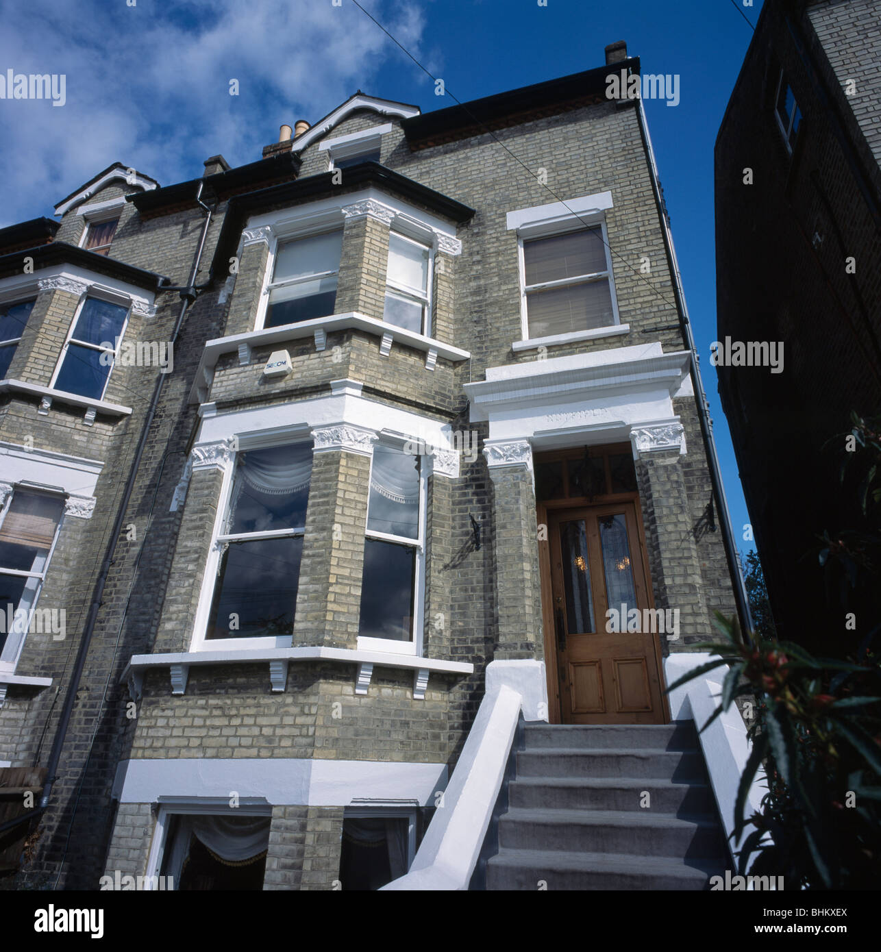 Steps leading up to traditional Victorian semi-detached townhouse Stock ...